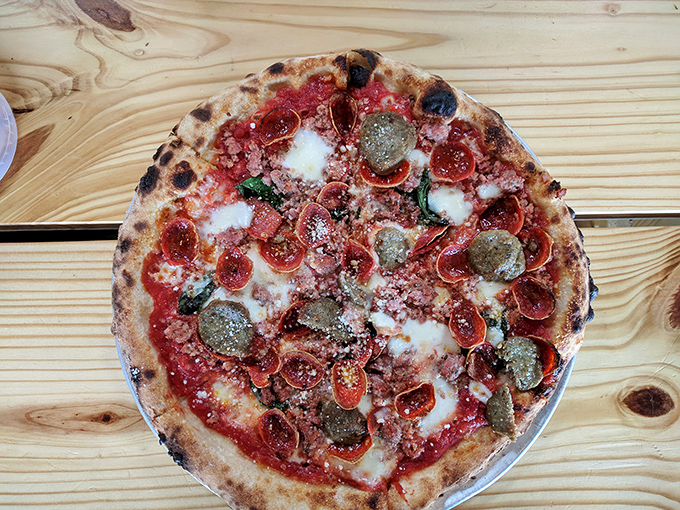 The pepperoni has curled into tiny flavor cups, collecting precious oils like nature's most delicious little hot tubs.