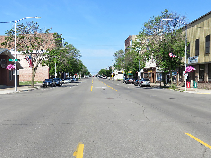 Ludington Street stretches toward Lake Michigan like an arrow, flanked by hanging flower baskets that would make Martha Stewart drop her gardening shears in admiration.