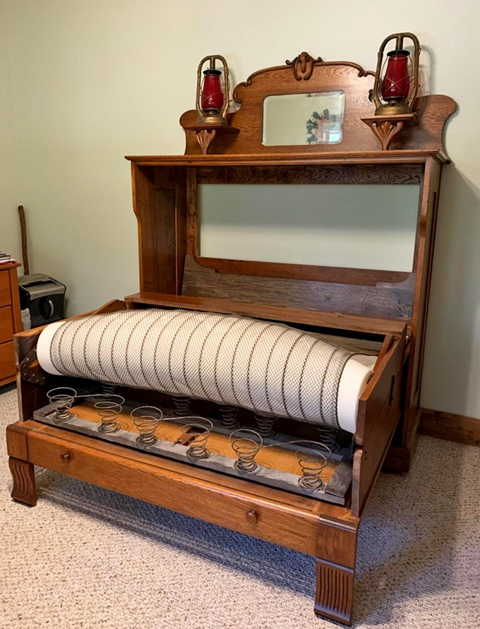 Not your average Murphy bed&mdash;this oak masterpiece with oil lamps and intricate detailing makes modern furniture look like it's not even trying.