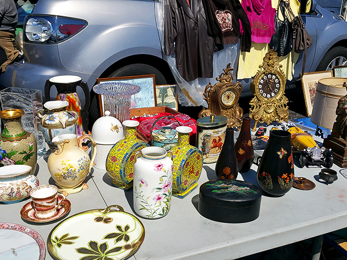 Grandma's china cabinet exploded across a folding table. Each piece whispers stories of dinner parties past and waits for new memories to be made.