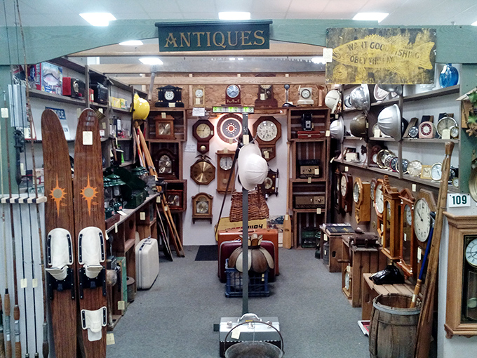 Time stands still in this vendor's booth where vintage clocks and wooden skis create a nostalgic tableau of leisure activities from simpler times.