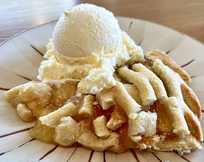 The holy grail that launched a thousand road trips. That flaky crust and vanilla ice cream melting into warm apples is worth crossing county lines for.