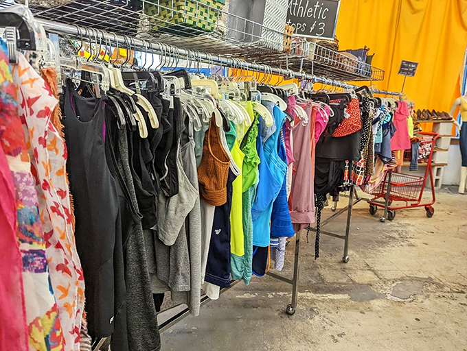 A rainbow of hangers holds countless stories. Each garment represents both sustainability in action and the possibility of reinvention for savvy shoppers.