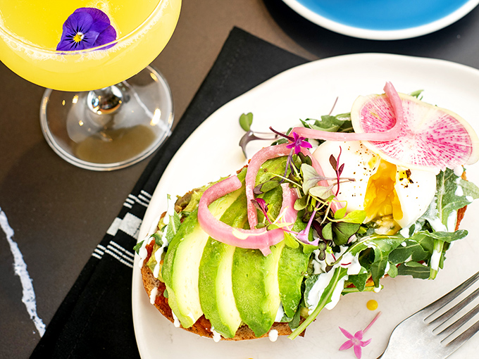Avocado toast gets the royal treatment with perfectly fanned slices, watermelon radish, and edible flowers&mdash;Instagram's favorite breakfast dressed for the red carpet.