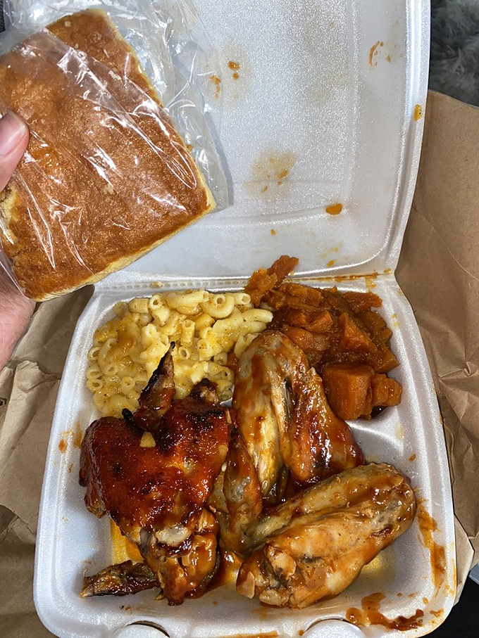 Takeout never looked so tempting. That cornbread is the unsung hero here&mdash;the perfect sauce-sopping companion to those glistening wings.