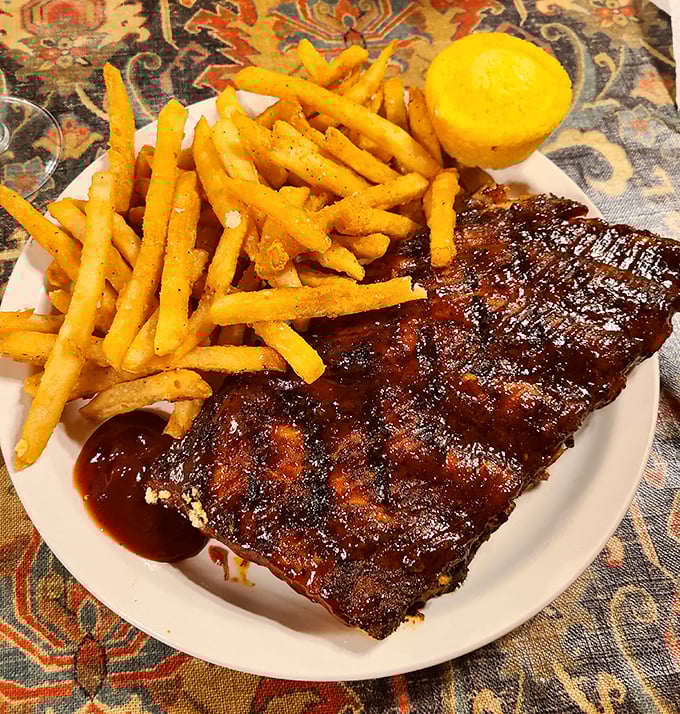 Ribs with a bark so perfect they should be in a barbecue museum. The meat doesn't fall off the bone&mdash;it respectfully parts ways when asked nicely.