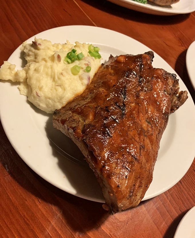 These baby back ribs with their glossy BBQ sheen aren't falling off the bone&mdash;they're voluntarily leaping into your mouth while those mashed potatoes stand by as worthy companions.