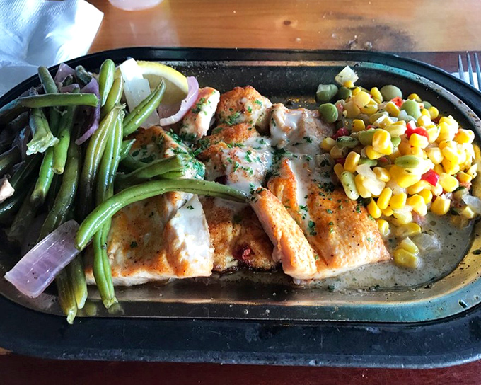 The Back Porch Mahi arrives like seafood royalty &ndash; perfectly grilled and crowned with shrimp and that legendary lemon beurre blanc sauce.