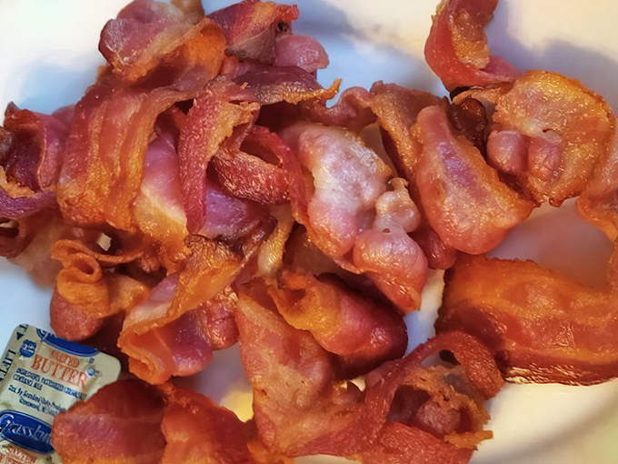 Bacon so perfectly crisp it deserves its own fan club. This isn't just breakfast meat; it's edible art with a side of cholesterol.