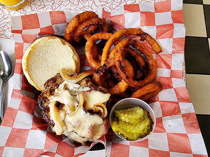 This isn't just a burger&mdash;it's a towering monument to American ingenuity, where melted cheese cascades over beef like a yellow waterfall of joy.