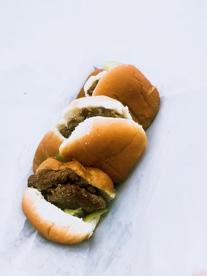 Lined up like soldiers ready for duty, these sliders don't need fancy packaging to make their point. Good food speaks for itself. 