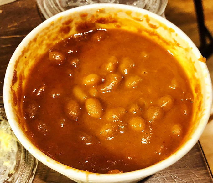 Rum baked beans that could make a vegetarian question their life choices. Sweet, savory, and unapologetically saucy.