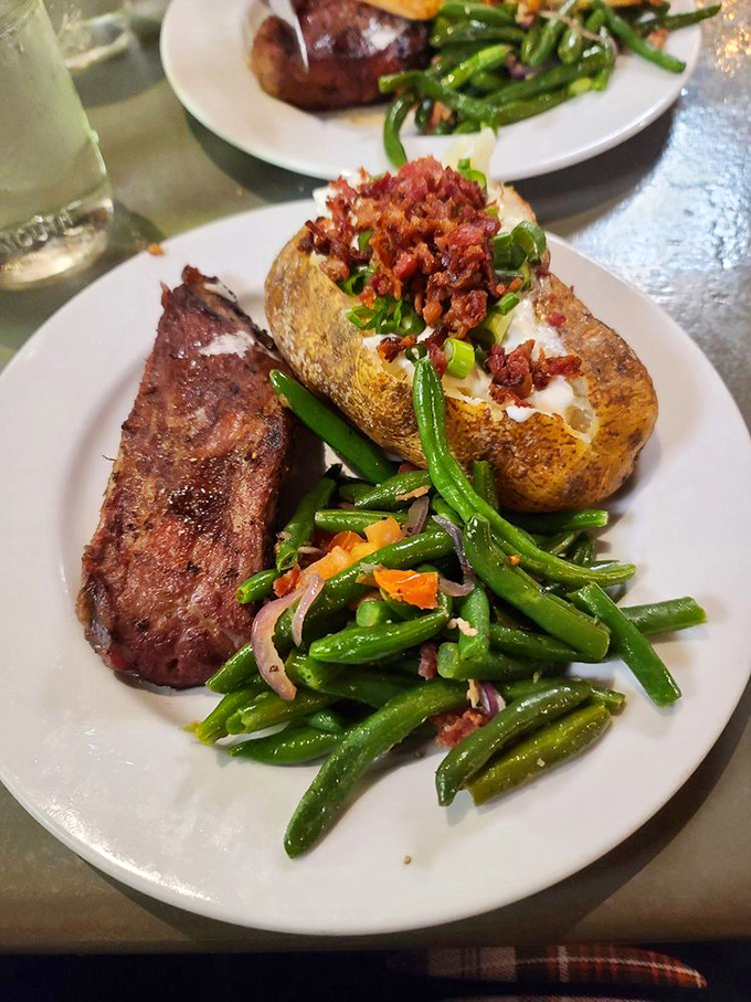 The loaded baked potato isn't just a side dish&mdash;it's practically its own zip code. That bacon topping isn't being subtle about its intentions to derail your healthy eating plans.