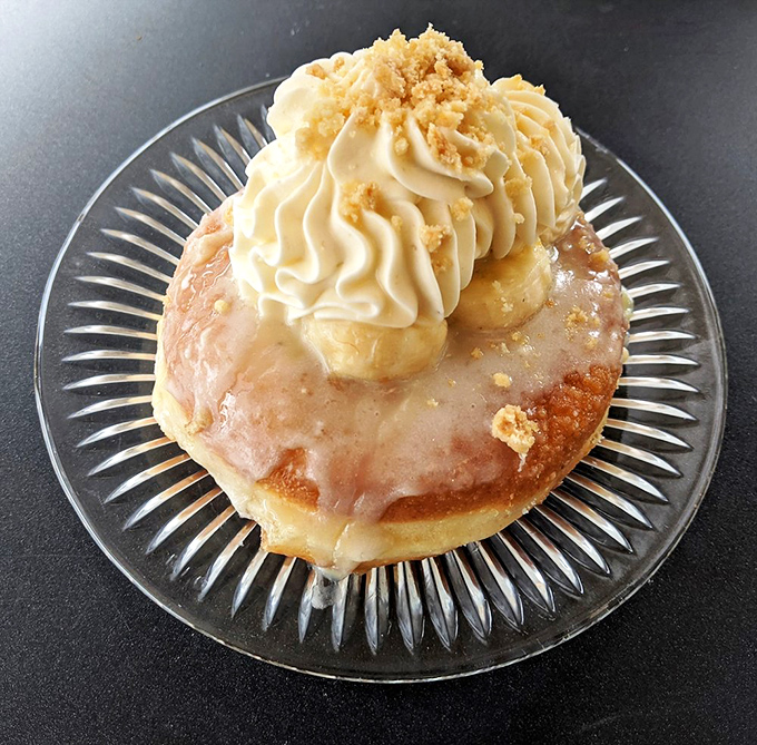 Meet the Banoffee donut&mdash;banana and toffee in perfect harmony, crowned with cream and crumble. It's like someone turned the classic British dessert into breakfast-appropriate art.