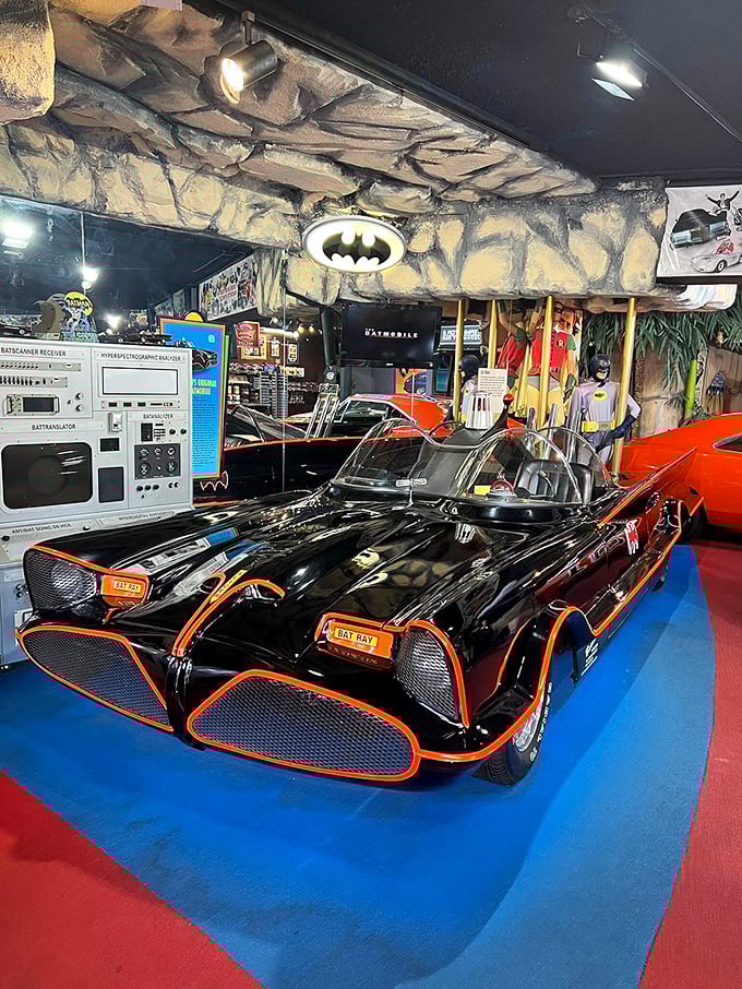 Holy automotive history, Batman! The classic 1966 Batmobile gleams with its distinctive bat emblems and rocket exhaust, bringing Adam West's caped crusader era roaring back to life.