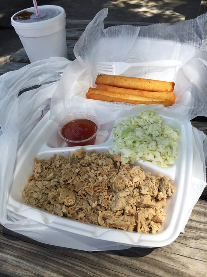 Styrofoam never looked so good. Chopped pork, crisp slaw, and golden cornsticks&mdash;a North Carolina postcard you can eat.