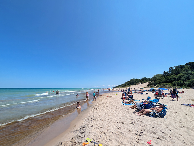 Summer's perfect equation: sand + water + sunshine = joy. Beachgoers soak up the rays along Indiana's surprising coastline, a slice of paradise in the heartland.