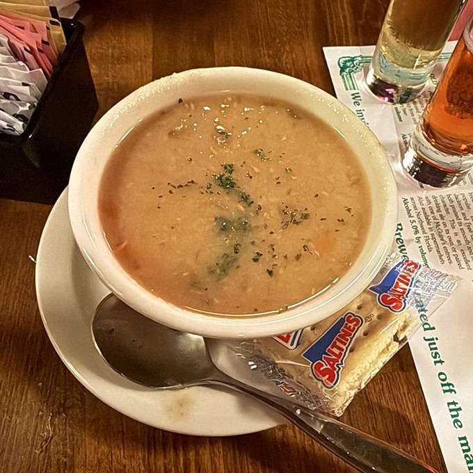 Soup that looks like it's been simmering since the Middle Ages—in the best possible way. The crackers are just there for moral support.