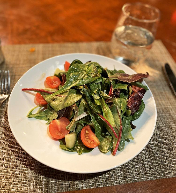 Fresh greens dance with ruby-red tomatoes in this vibrant salad&mdash;proof that sometimes the simplest combinations create the most memorable flavors.