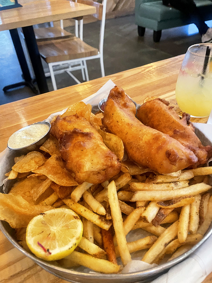 Golden-battered fish and crispy fries that would make a British pub jealous. The squeeze of charred lemon isn't just garnish—it's essential.