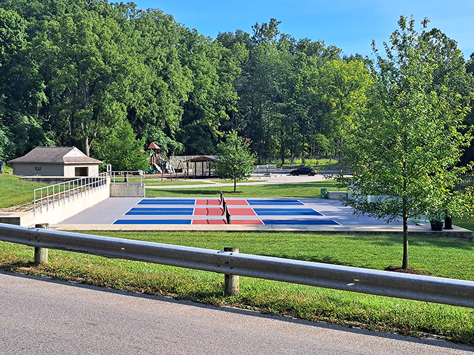 Primary colors pop against summer green at Bicentennial Jaycee Park. This playground proves you're never too old to appreciate a good slide design. 