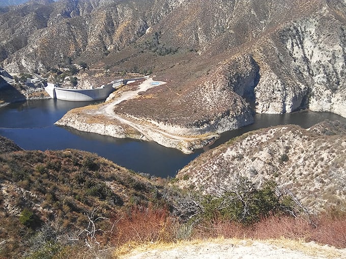 The Big Tujunga Dam creates a serene reservoir that looks like it belongs on a postcard, not minutes from urban sprawl.