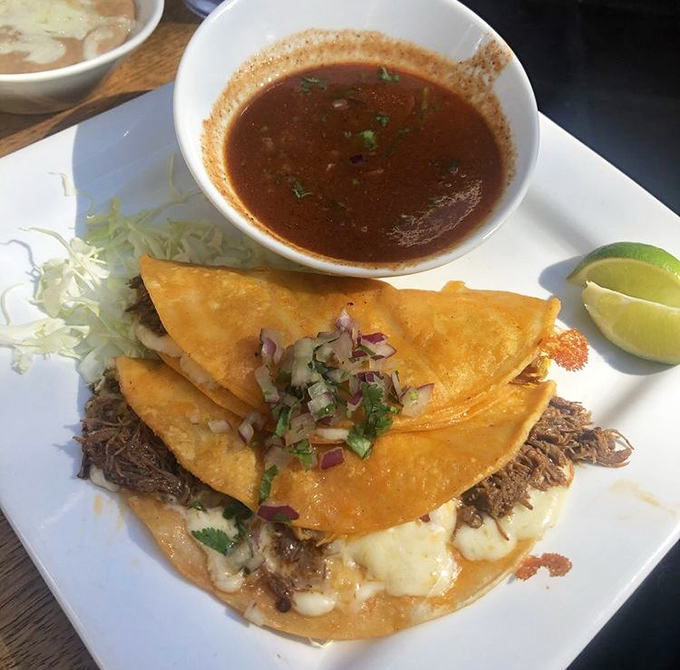 Birria tacos so good they should come with a warning: "May cause spontaneous happiness and the urge to book a flight to Mexico."