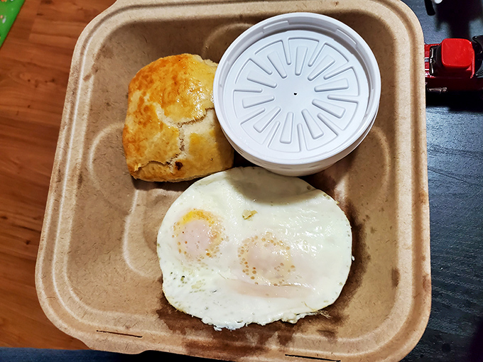 Simple breakfast perfection doesn't need to shout. Two sunny eggs and a biscuit that would make your grandmother both proud and jealous.