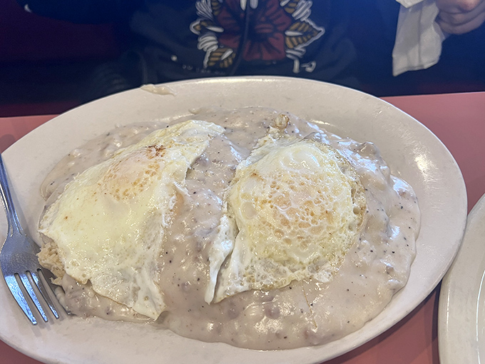Biscuits and gravy so legendary they deserve their own Ohio historical marker &ndash; those eggs aren't floating, they're crowning the masterpiece.