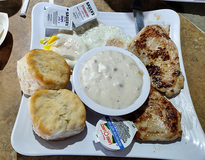 Biscuits so fluffy they could float away if not anchored by that perfect pepper gravy. Breakfast nirvana on a plate.