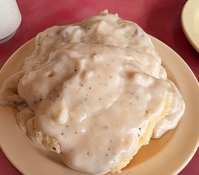 Biscuits and gravy so generous they've disappeared under a creamy avalanche. This isn't a side dish&mdash;it's the main event with its own gravitational pull.