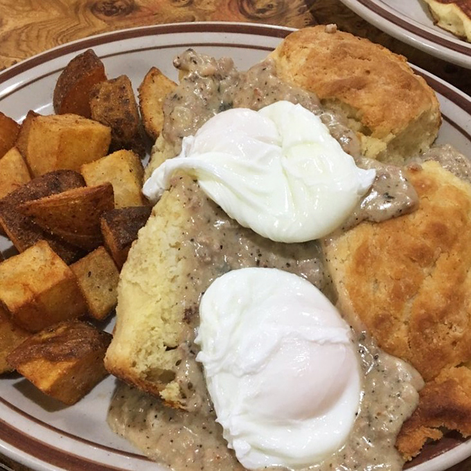 Fluffy biscuits drowning in peppery sausage gravy represent comfort food engineering at its most scientifically satisfying peak.