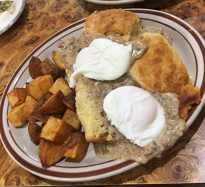 Biscuits and gravy with poached eggs—comfort food engineering at its finest, where every forkful delivers the perfect balance of savory, creamy, and hearty.