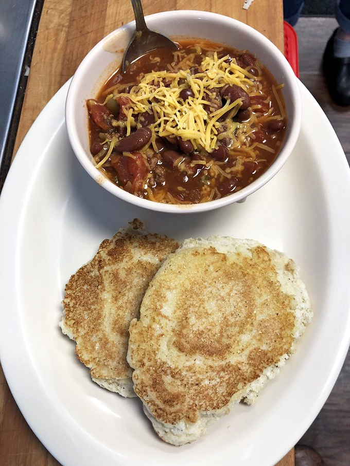 Fluffy biscuits meet hearty chili in a combination that defies logic but delivers satisfaction.