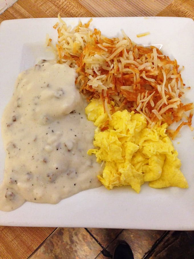 Biscuits and gravy – the ultimate comfort food currency in the Midwest – served alongside scrambled eggs and hash browns that glisten with just the right amount of griddle love.