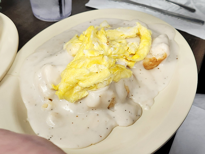 Southern gravy doesn't just cover biscuits&mdash;it embraces them like a warm hug from your favorite aunt. Pure comfort in monochromatic splendor.