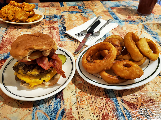 The burger-and-rings combo that launched a thousand road trips. That golden-brown crunch is the soundtrack to happiness.