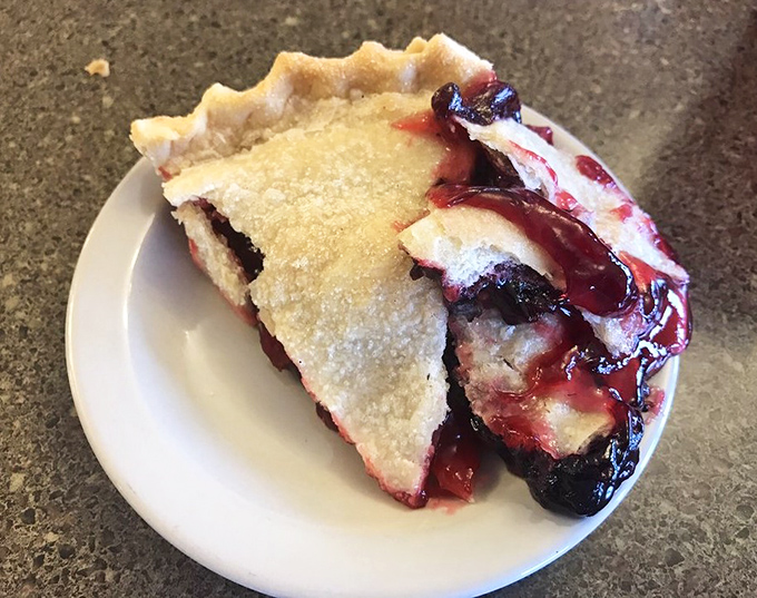 Berry meets butter in this bubbling blackberry pie that's worth every sticky-fingered, purple-tongued moment. Summer captured in a slice.