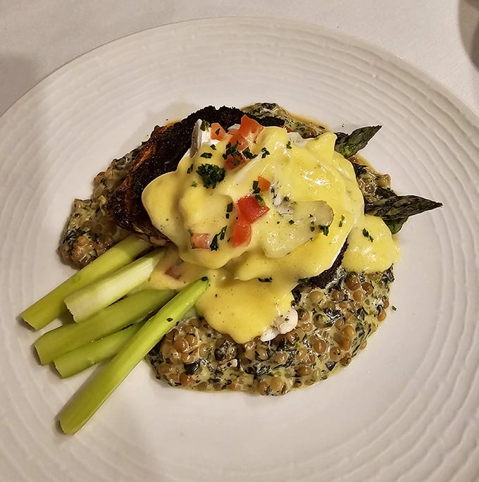 Blackened salmon meets Oscar-worthy presentation &ndash; the hollandaise cascading like a golden waterfall over asparagus soldiers standing at attention.