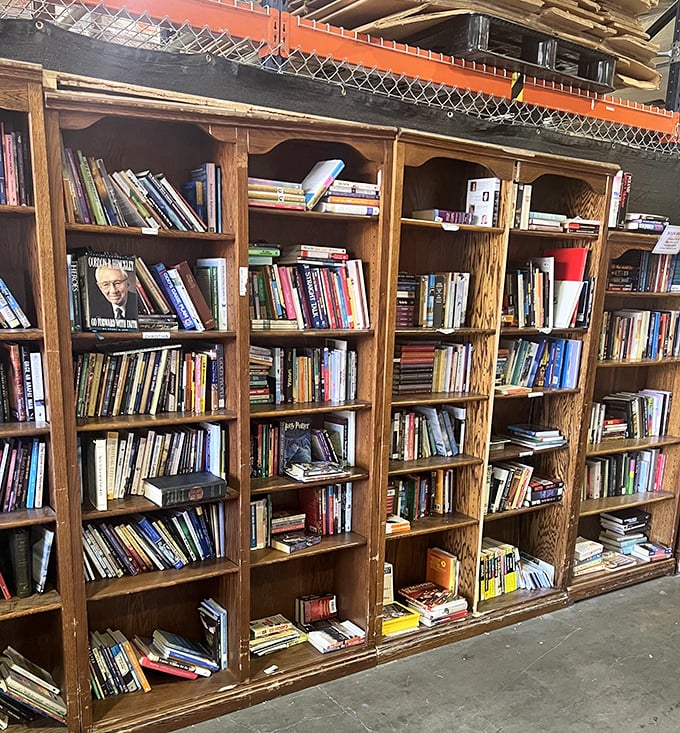 Bookworm bliss with towering oak shelves holding literary treasures from bestsellers to classics. Someone's beach read is about to become your bedside companion.