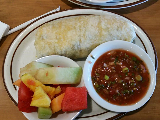 Breakfast wrapped in a warm tortilla hug, served with fresh fruit and salsa that wakes up your taste buds better than any alarm clock.