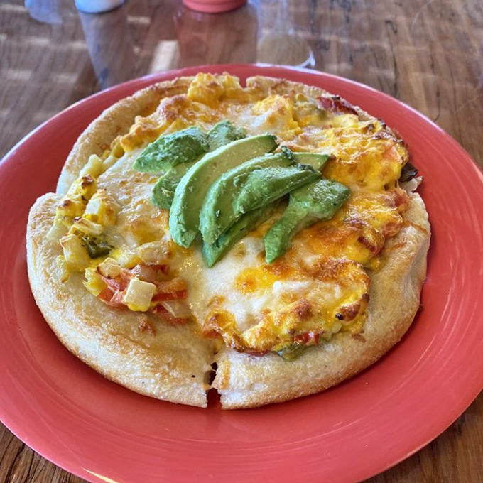 Breakfast pizza that makes you question why we ever limited pizza to lunch and dinner. The fresh avocado slices on top are nature's perfect garnish.