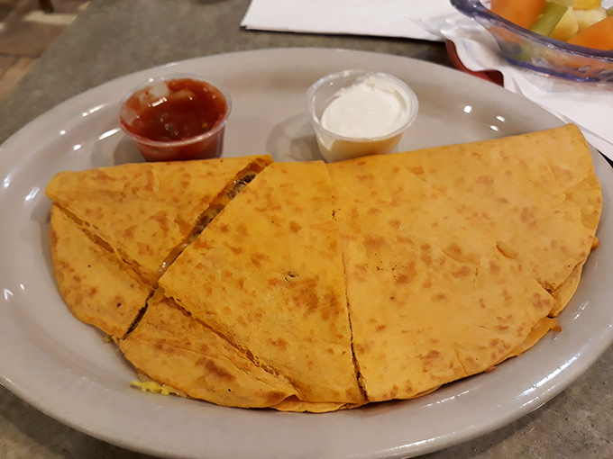 A breakfast quesadilla that's achieved the perfect tan &ndash; like it spent exactly the right amount of time on the beach of a well-seasoned griddle.
