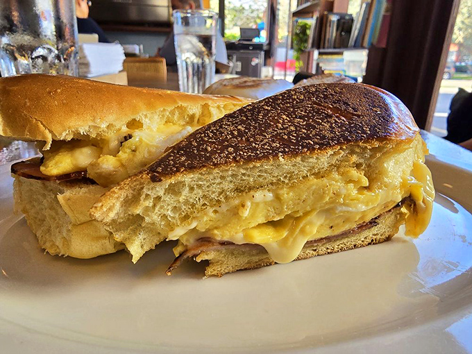 Breakfast sandwich architecture at its finest&mdash;golden bread cradling what appears to be melty egg and cheese, with plantain chips standing by for moral support.