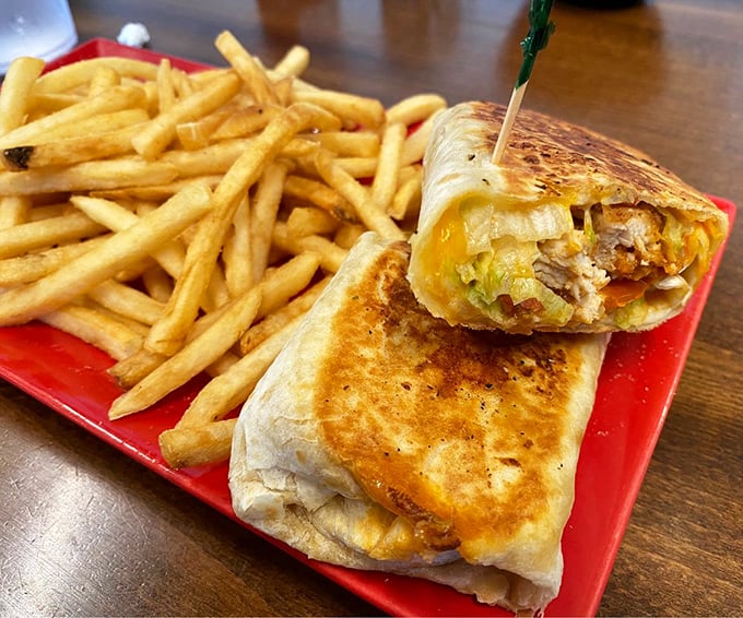 This isn't just a breakfast wrap—it's edible architecture, with golden-brown craftsmanship and French fries that deserve their own zip code.