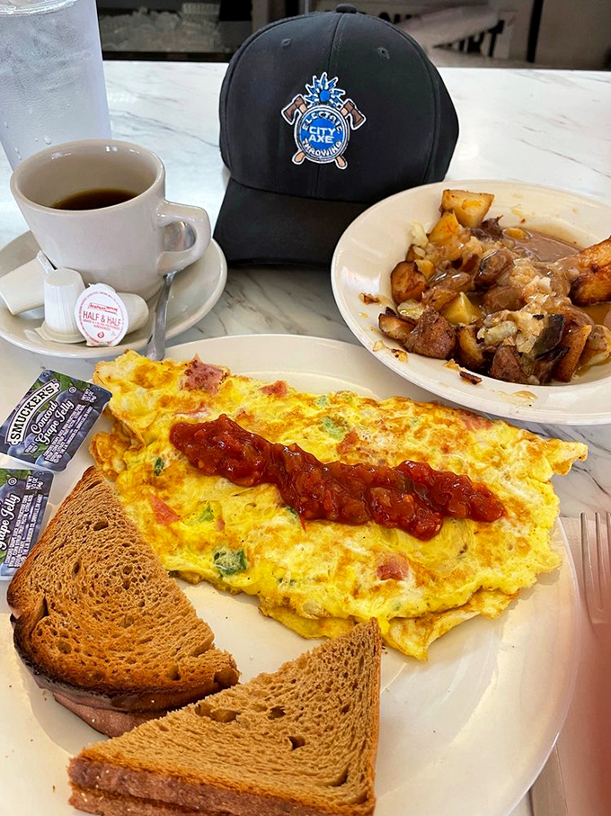 Breakfast perfection doesn't need fancy ingredients—just fluffy eggs, melted cheese, and the knowledge that home fries are nature's perfect side dish.