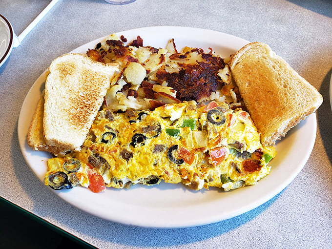 Perfectly executed Western omelet meets golden hash browns and toast &ndash; breakfast's greatest hits album served on a single plate.