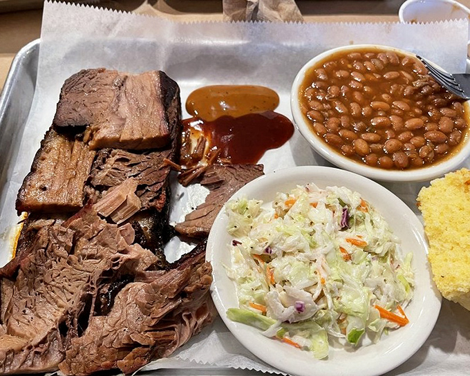 Brisket with the telltale pink smoke ring that BBQ aficionados seek, accompanied by fresh slaw, beans, and cornbread. This is Florida's comfort trifecta.