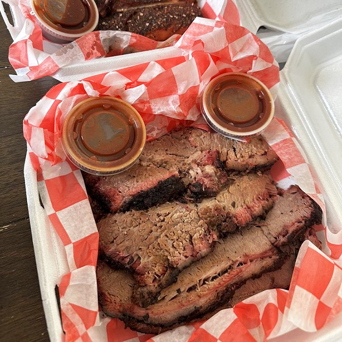 Brisket slices with that telltale pink smoke ring&mdash;the barbecue equivalent of Olympic gold. Each slice tells a story of low-and-slow dedication.