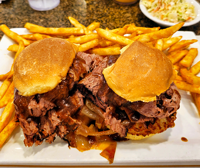 These brisket sliders aren't just sandwiches; they're tiny ambassadors of joy, complete with caramelized onions and golden fries.